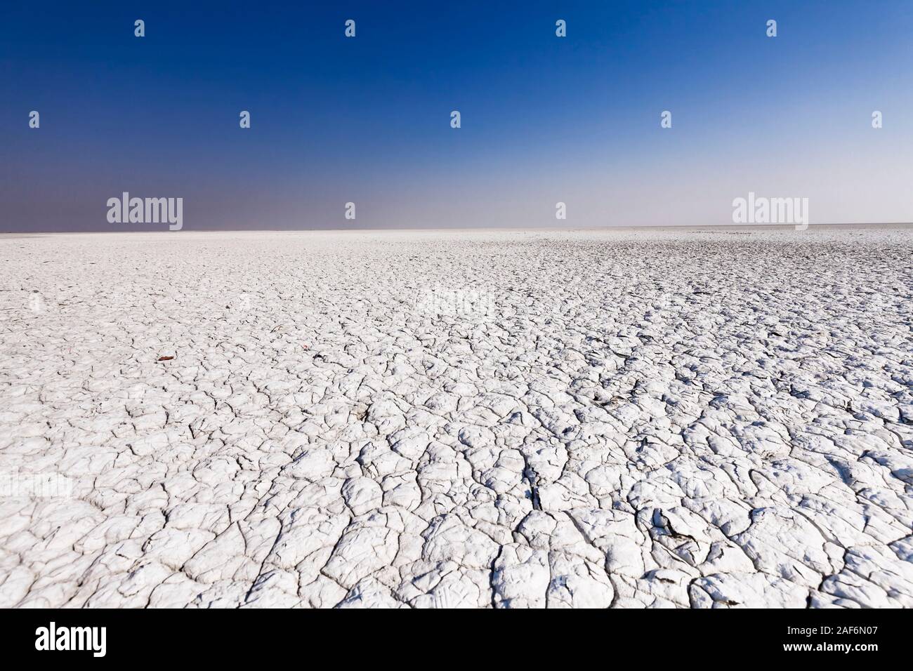 Dried up white salt pan, countless cracks, Sowa pan(Sua pan ...