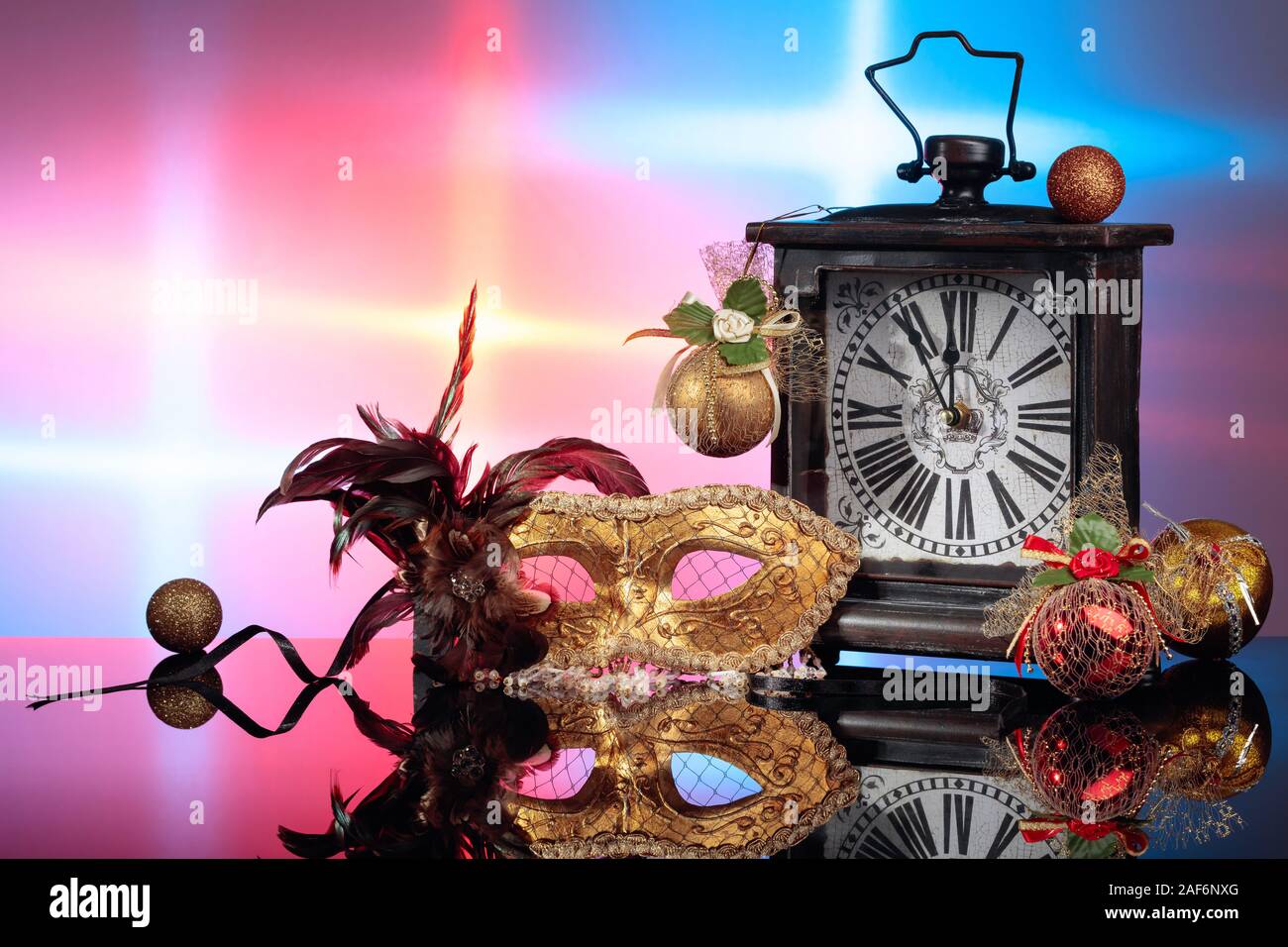 Vintage clock with Christmas decorations and golden carnival mask. Copy ...
