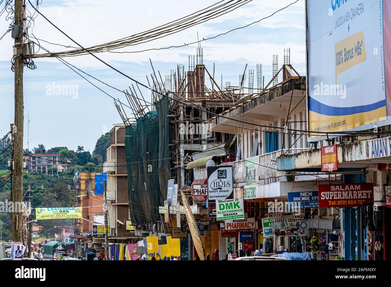 Scaffolding and construction in urban shopping district street scene in ...