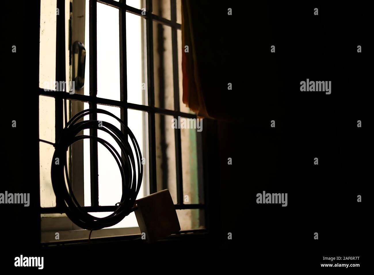 Electrical lines and telephone lines hang in the windows Stock Photo ...