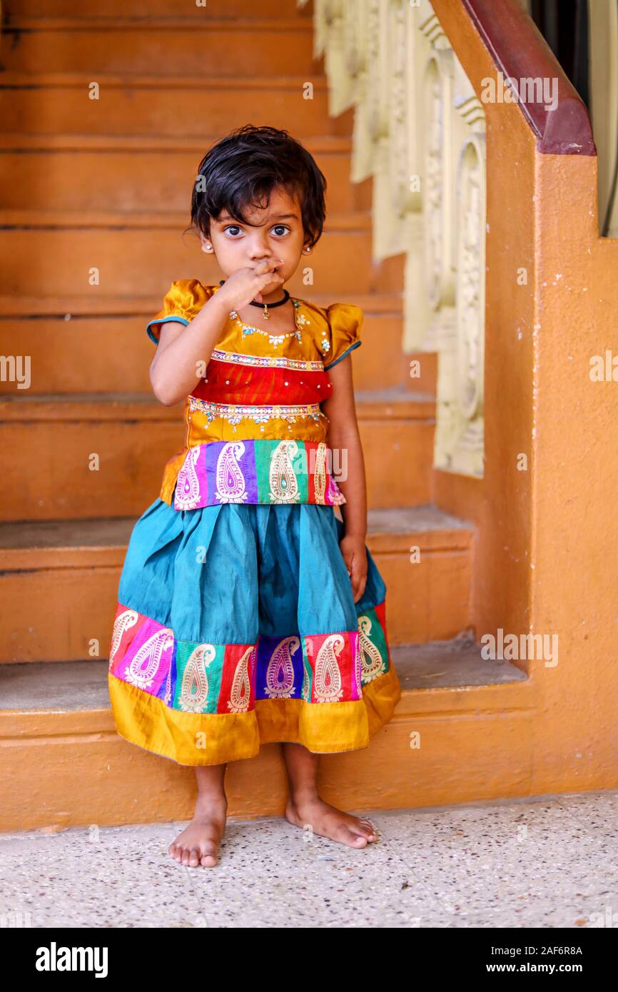 child little girl standing at home against stair Stock Photo - Alamy
