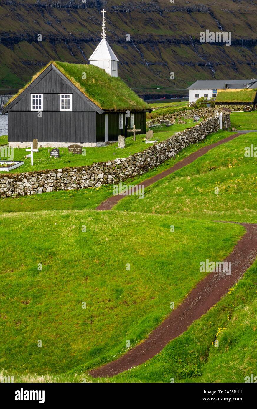 Church with grass on the roof and path in the grass Stock Photo - Alamy