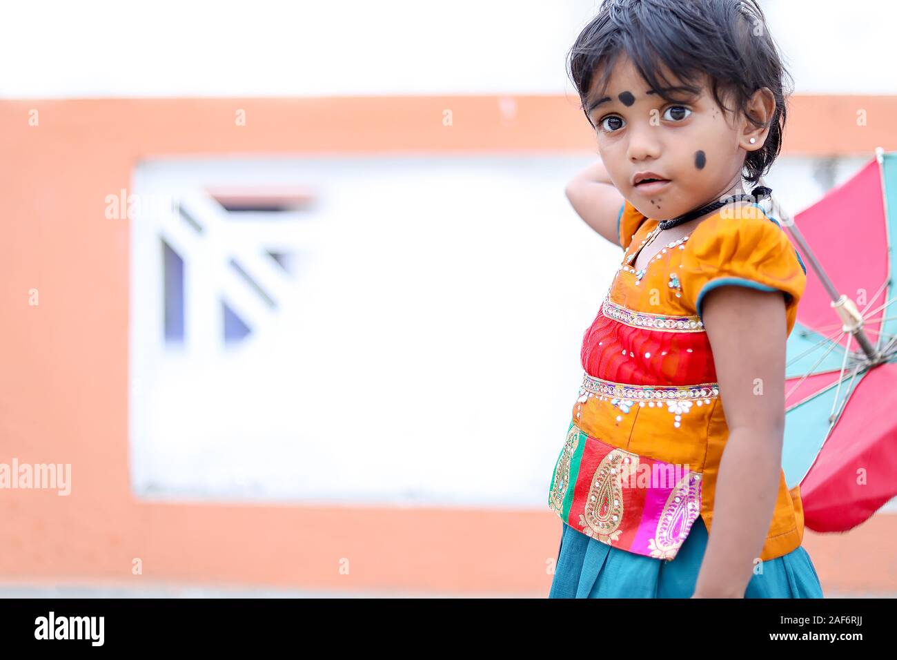 Cute Little Kid Holding An Umbrella Stock Photo - Alamy