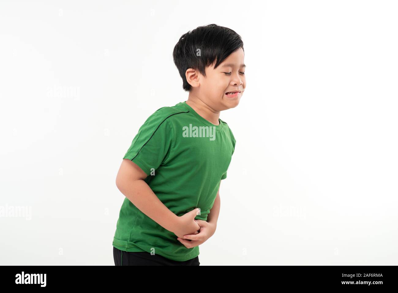 Little boy suffering from stomach pain Stock Photo - Alamy