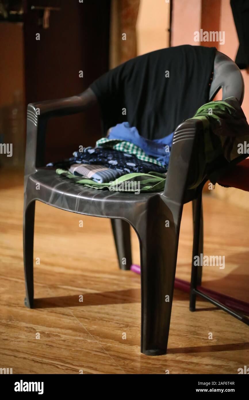 Pile clothes chair hi-res stock photography and images - Alamy