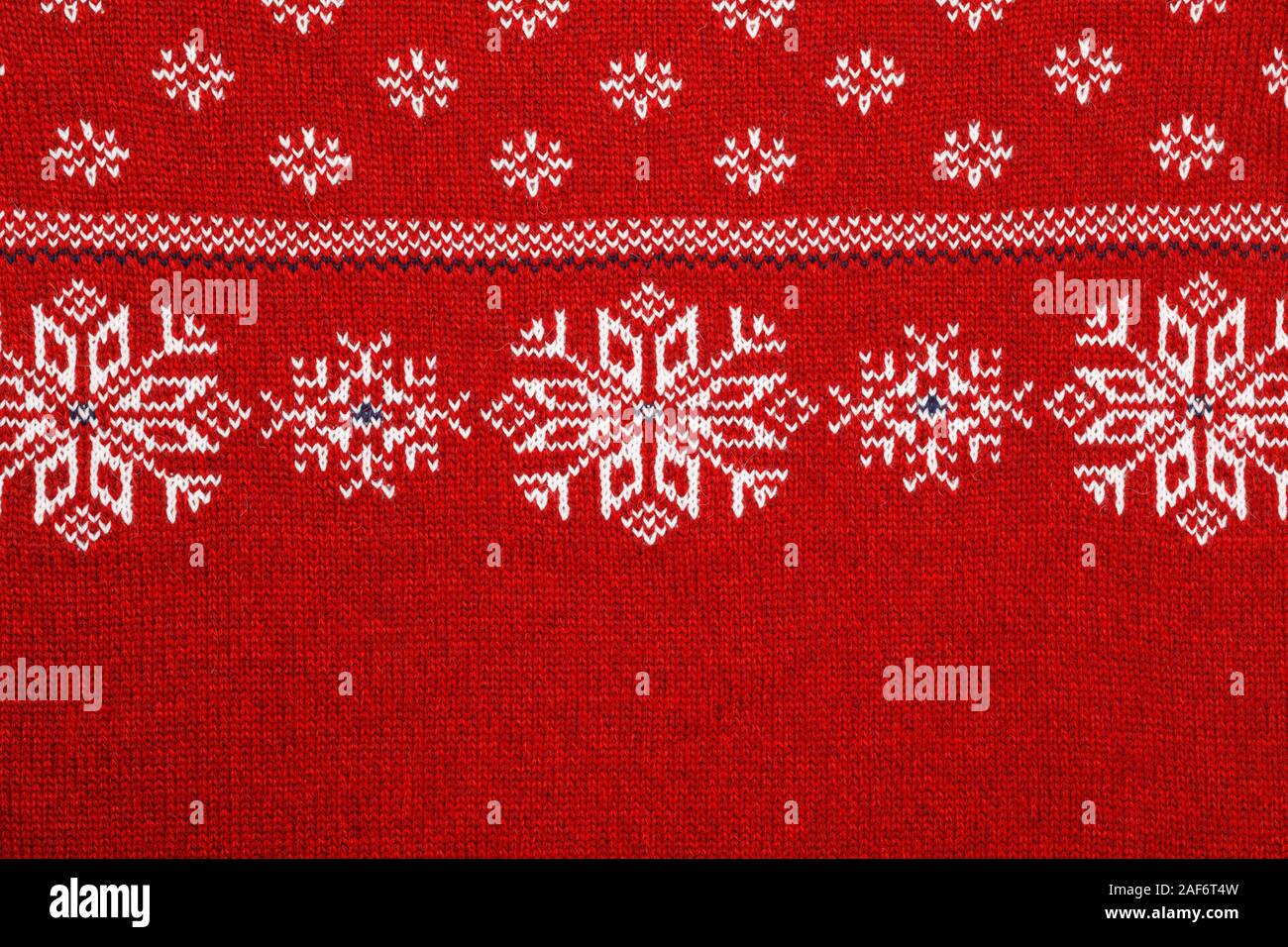Red knitted fabric with white Scandinavian geometric ornament Stock ...