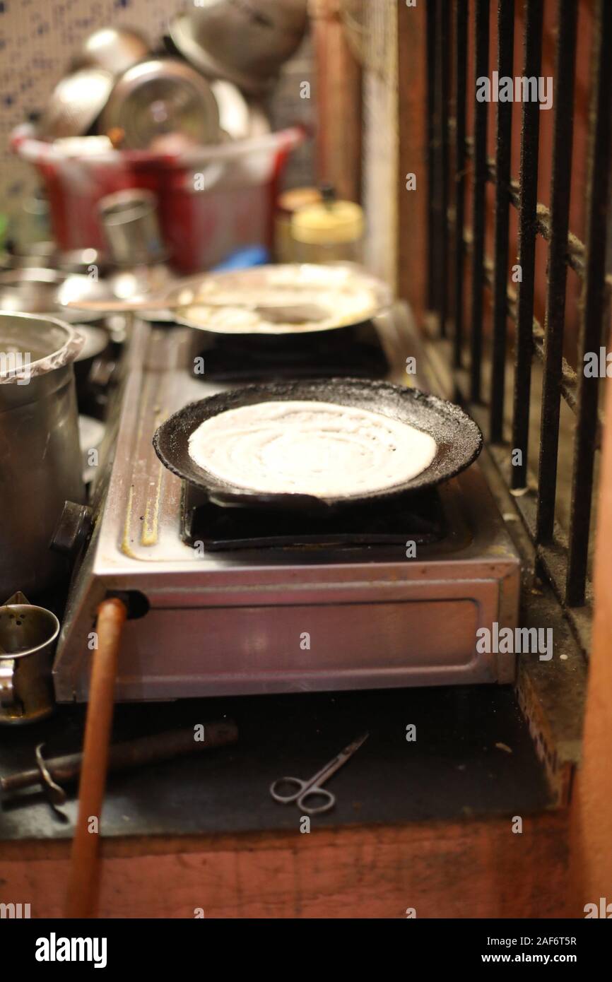 cooking dosa in kitchen, India. South Indian vegetarian Stock Photo - Alamy