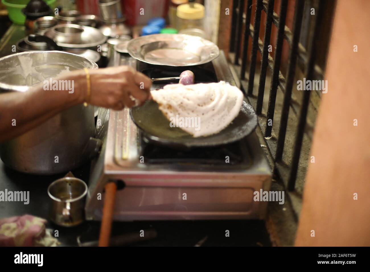 Indian woman making dosa hi-res stock photography and images - Alamy