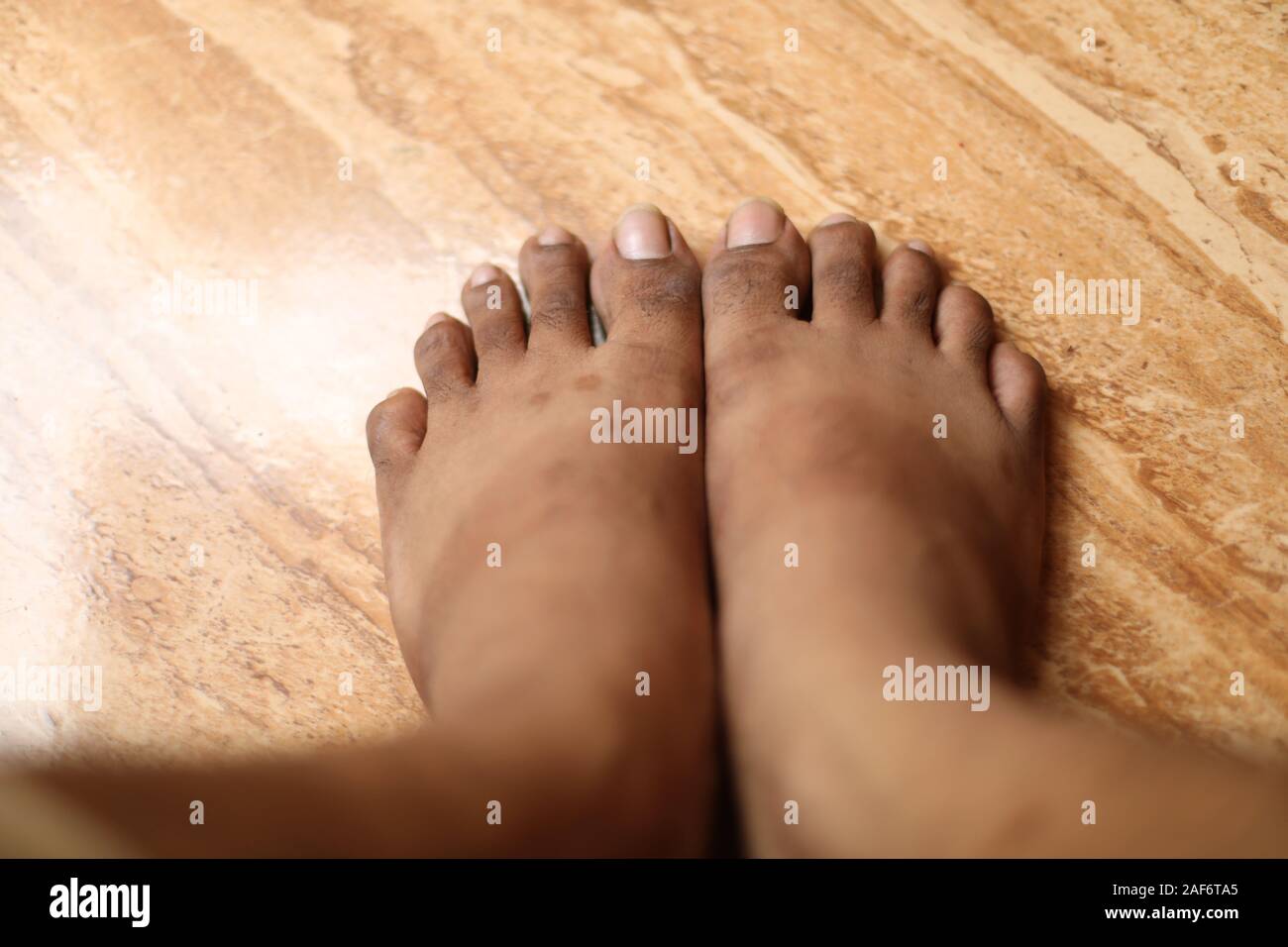 Top view barefoot on House floor tiles background. men feet Stock Photo ...
