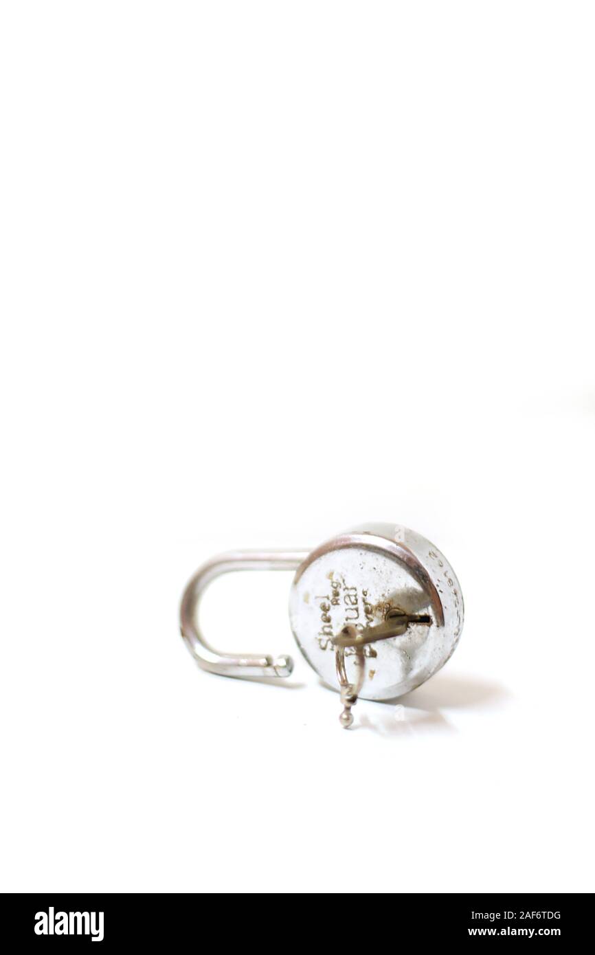 Rusty old lock with the key on white backgrounds Stock Photo - Alamy