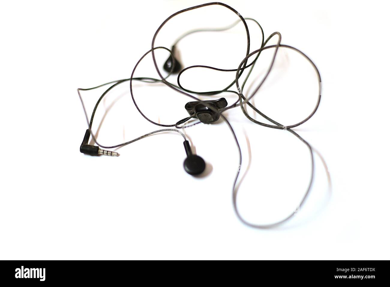 Close-up of black earbuds on white backgrounds Stock Photo - Alamy