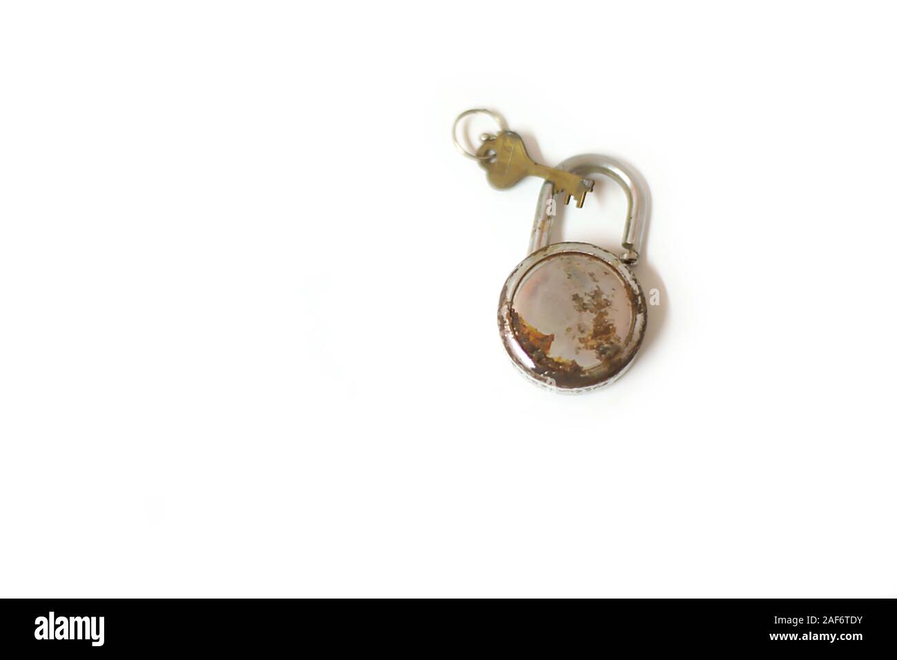 Old and rusty pendulum lock with keys Stock Photo - Alamy