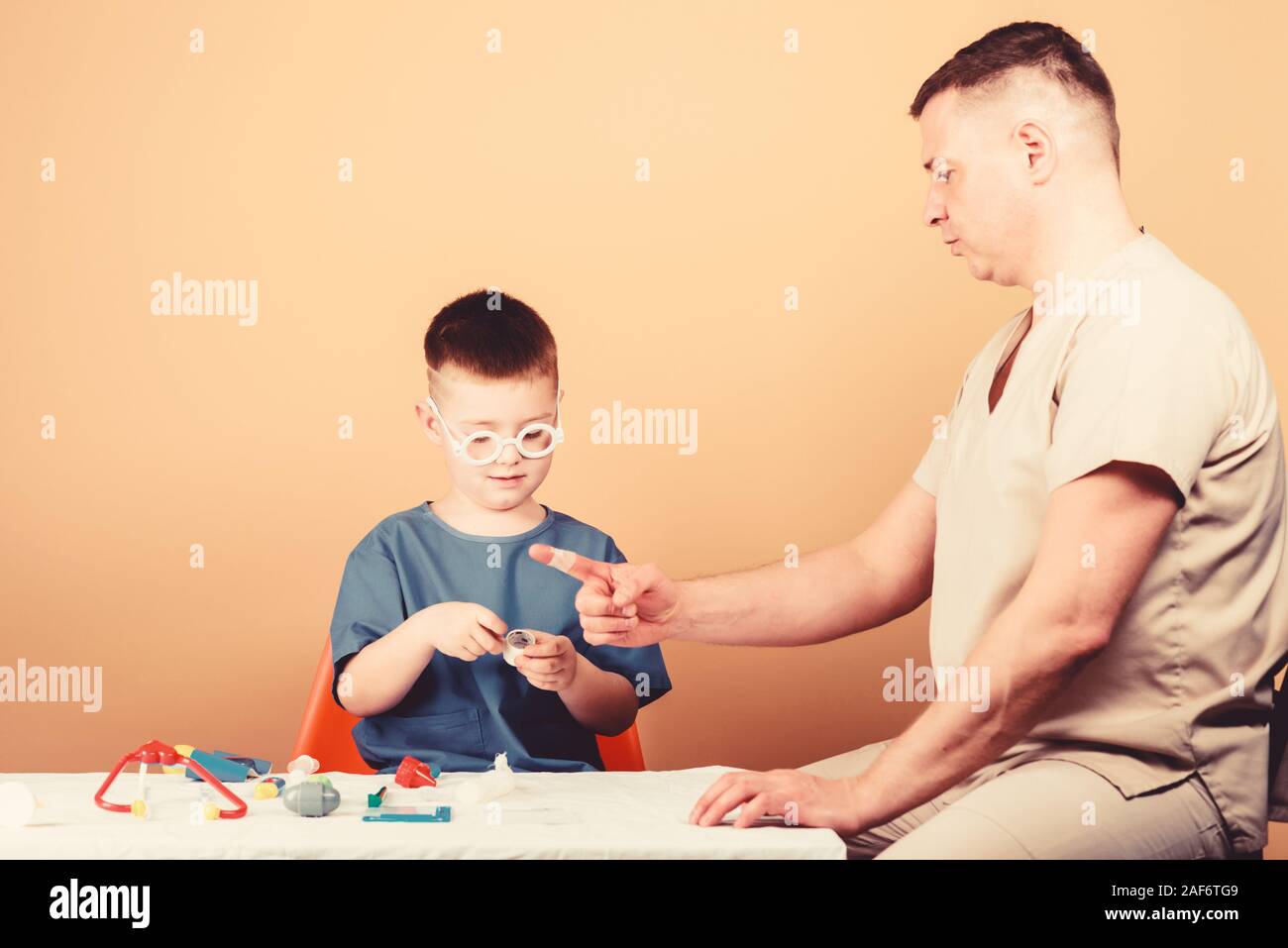 Health care. Medical examination. Boy cute child and his father doctor ...