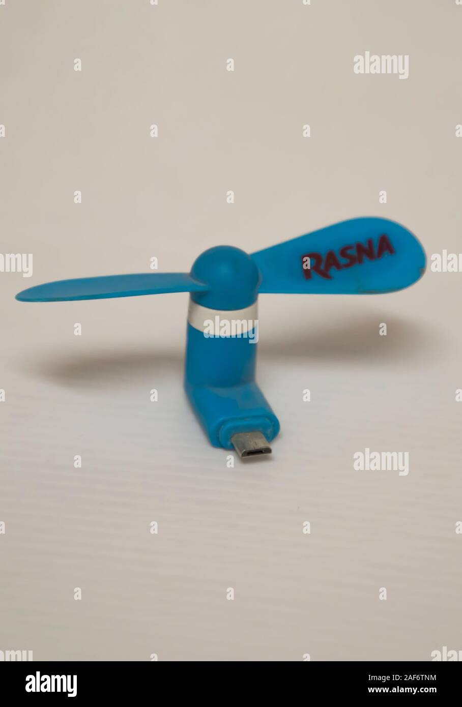 Blue mobile USB fan on isolated, White Background Stock Photo - Alamy