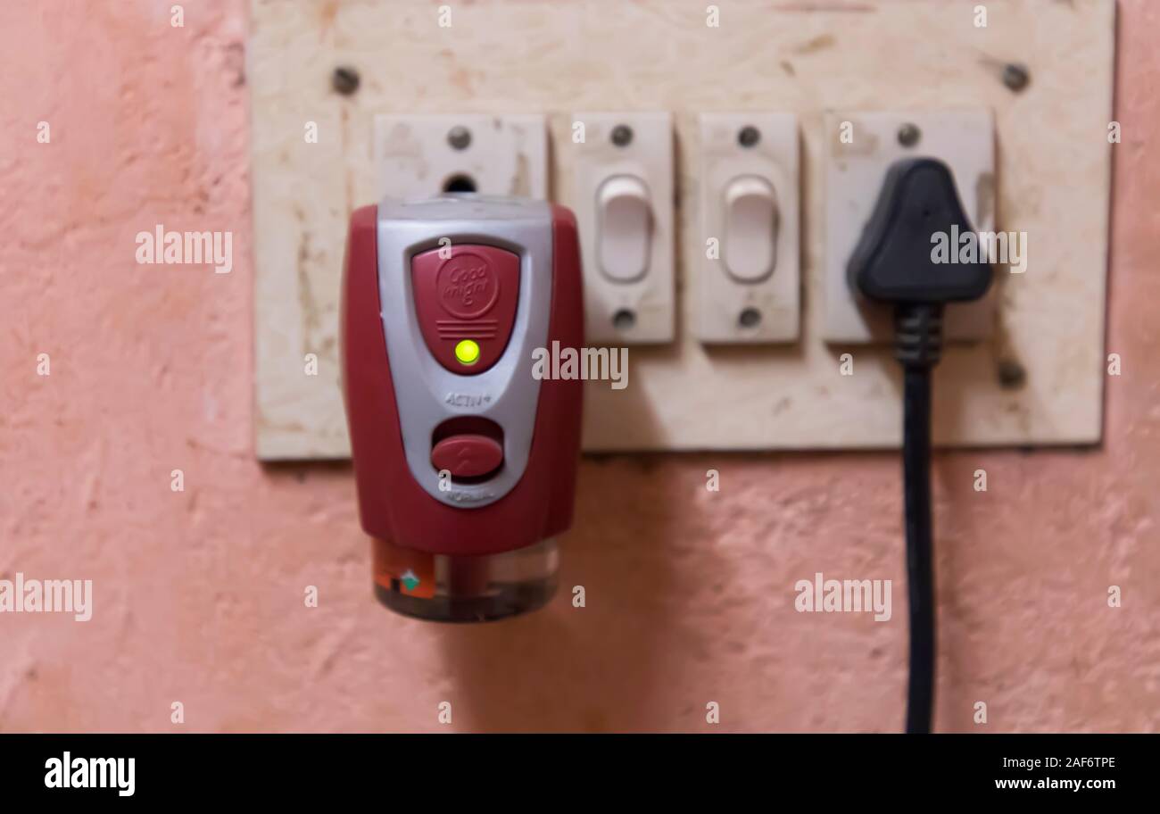 Electric anti mosquito fumigator plugging on the wall socket Stock ...