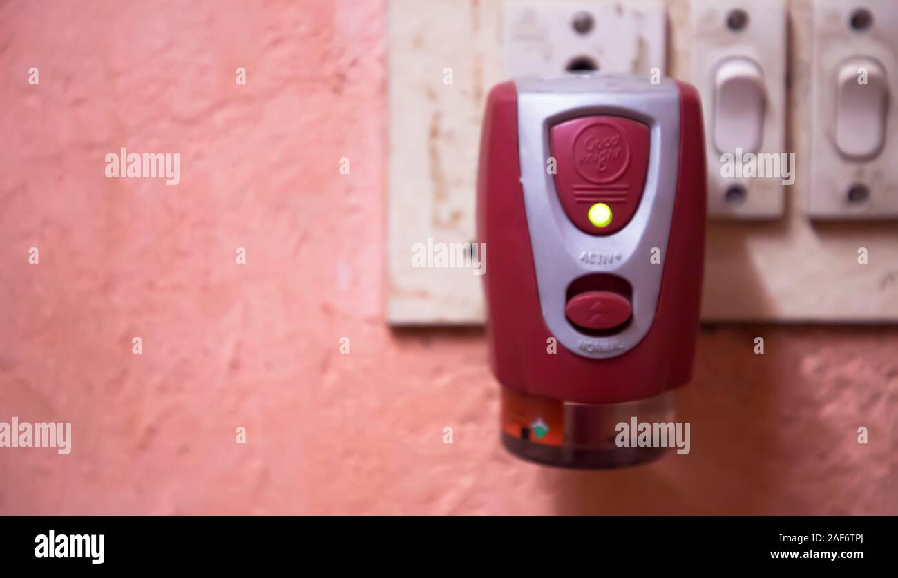 Mosquito killer. Electric raptor fumigator at outlet Stock Photo - Alamy