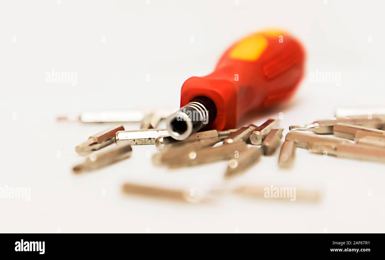 Repair screws to a plastic red and yellow handle Stock Photo - Alamy