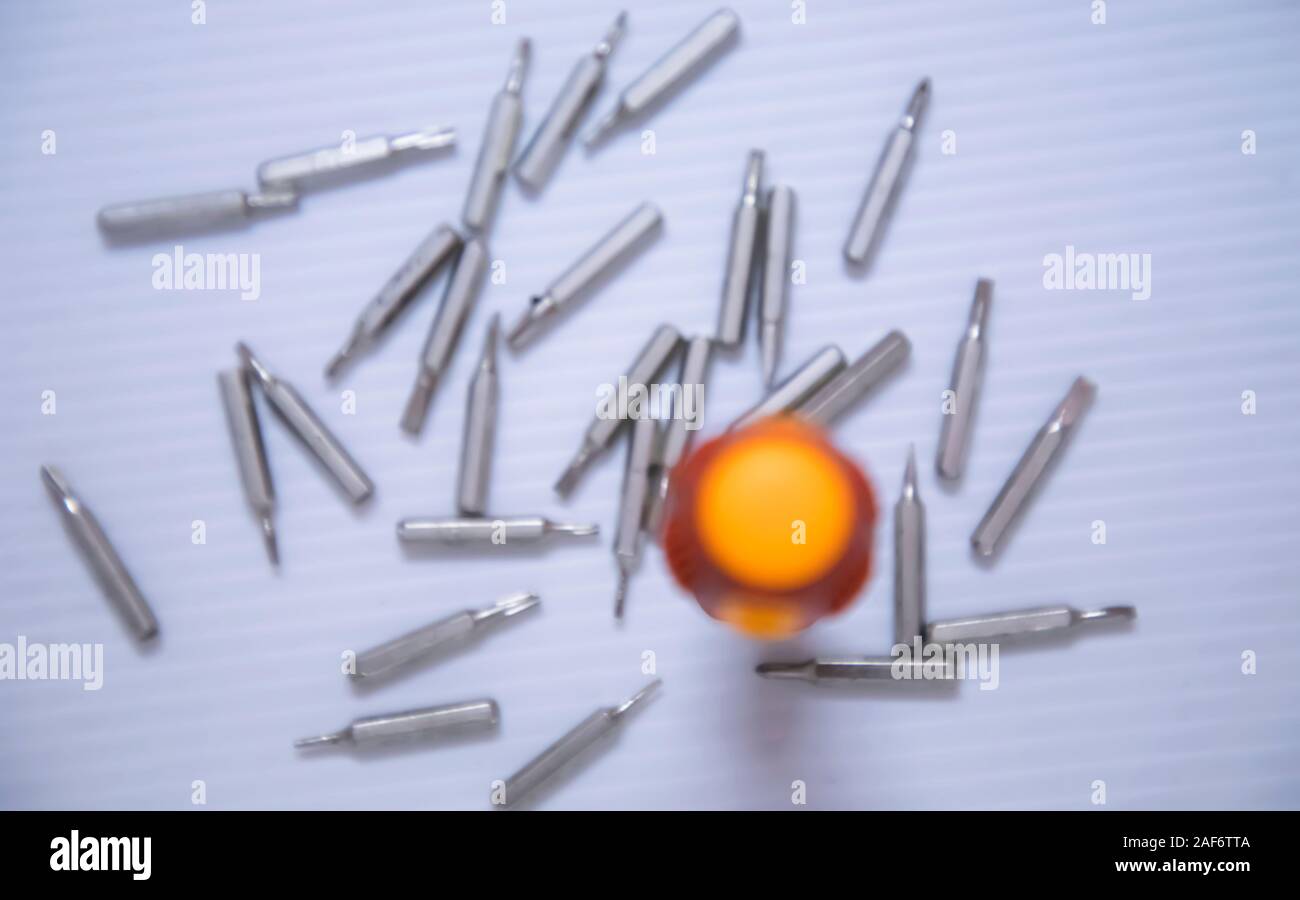 Yellow and red hand screwdrivers and screws isolated on white ...