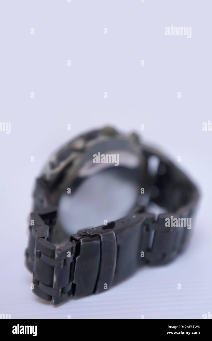 man watch against white background, back view Jain Stock Photo - Alamy