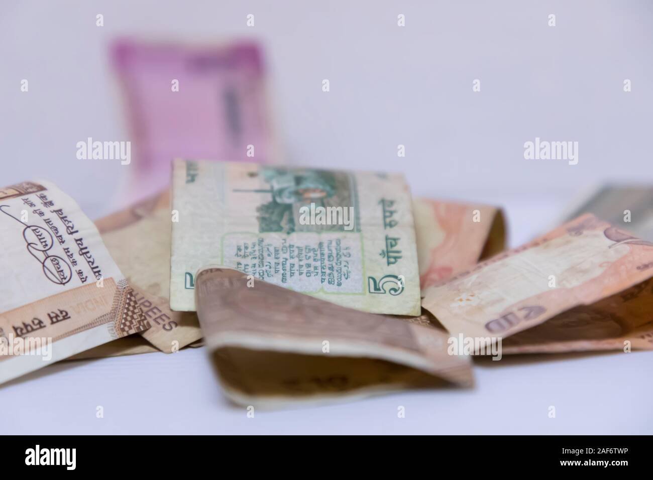 Indian currency bank notes of 5 and 10, 20, 500, 2000 rupees on white ...