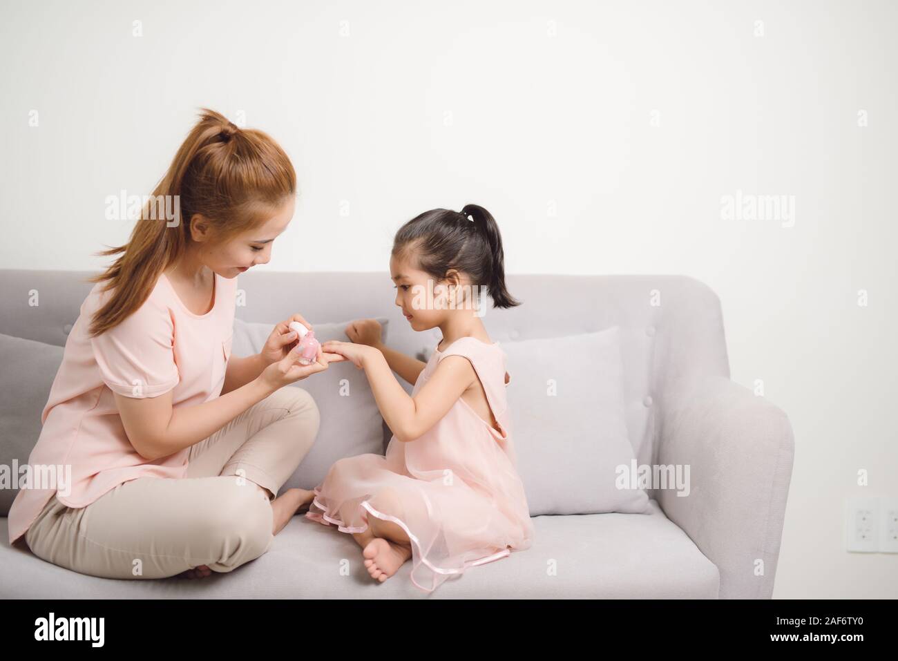 Mother and daughter in the room Stock Photo - Alamy