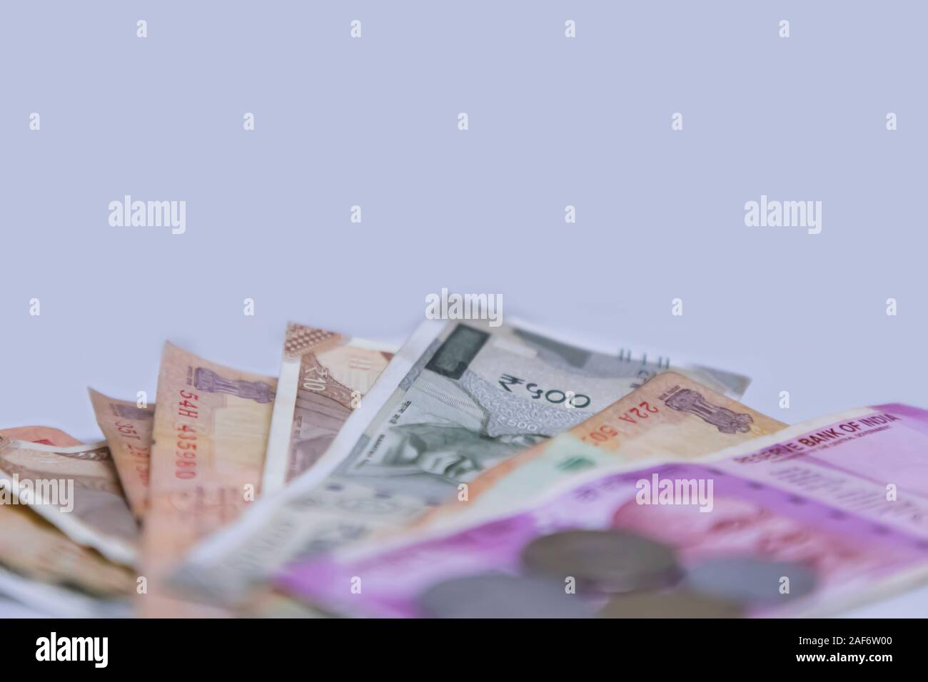 Indian currency bank notes of 500 and 2000 rupees with coins - white ...