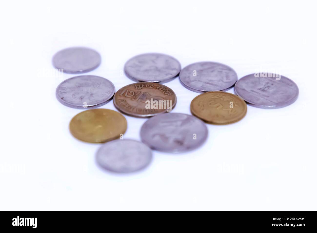 Indian small coins are rupees. white background Stock Photo - Alamy