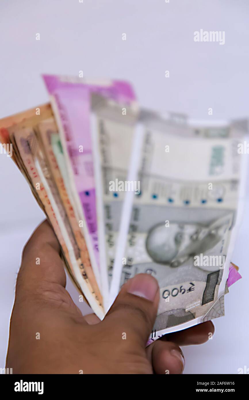 Hands of businessman holding money, Indian Rupee currency Stock Photo ...