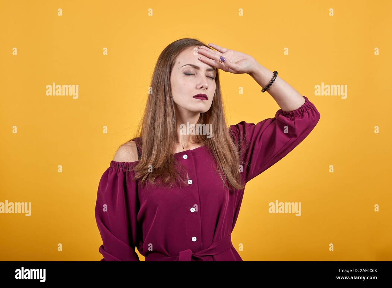 Woman ahead background hold her hand on forehead with tired and sick ...