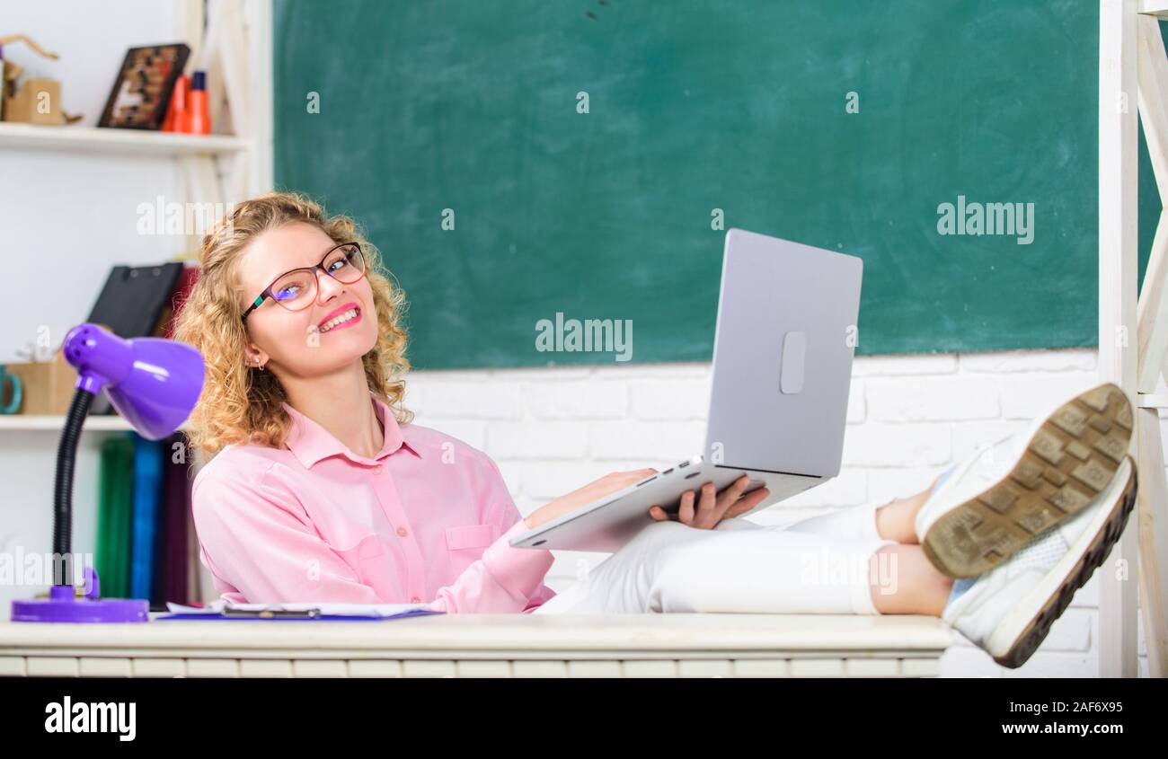 Online courses for adult. Teacher in classroom work with notebook ...