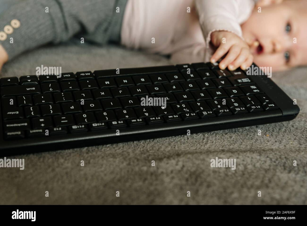 mall child grabs a mouse and keyboard, internet addiction from an early ...