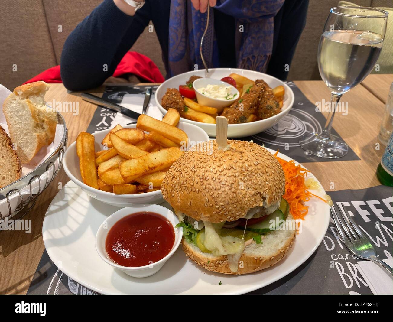 Junk food eating - woman eating delicious tasty fish and chips next to ...