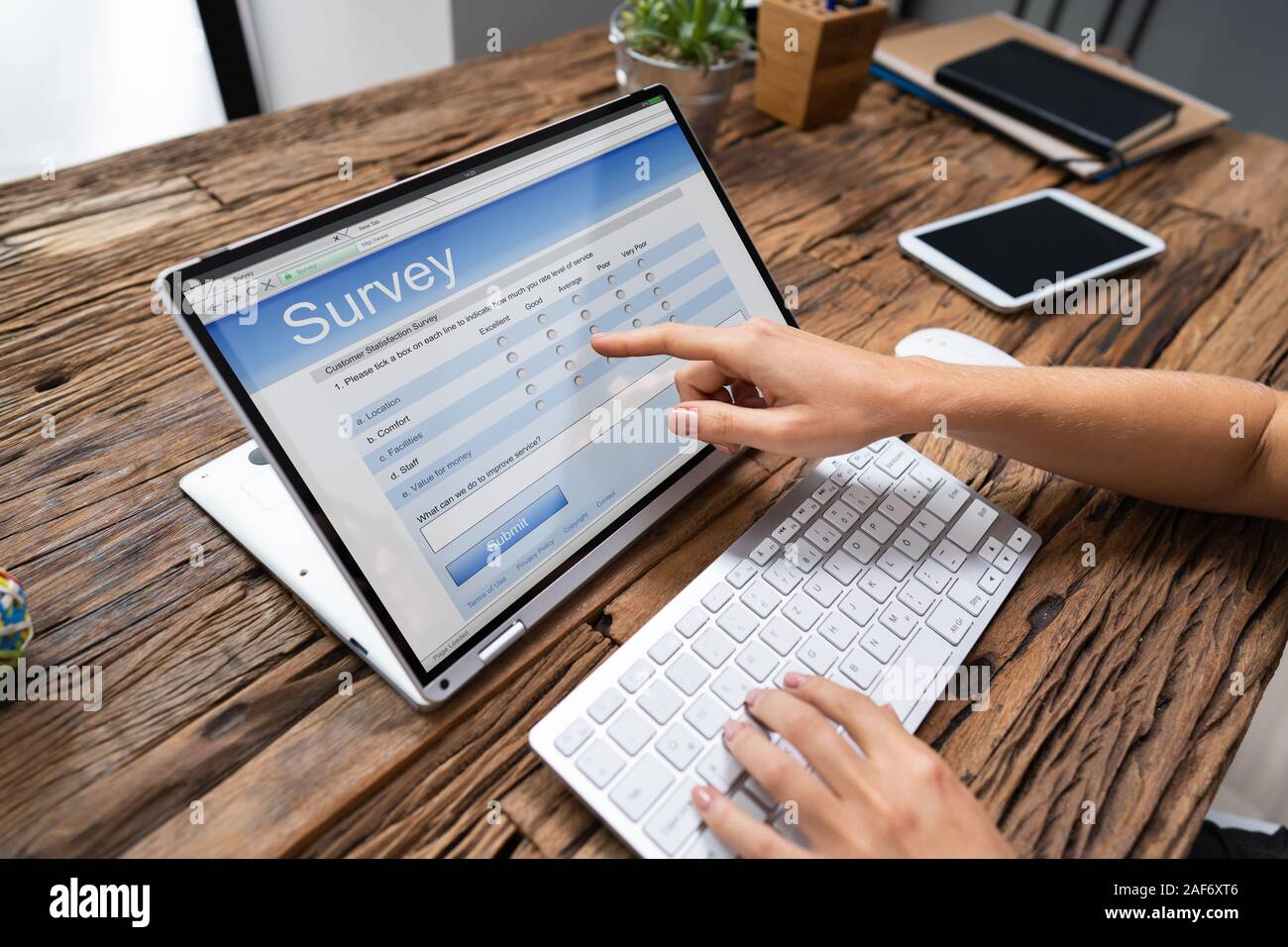 Cropped Image Of Businesswoman Giving Online Survey On Laptop At Office ...
