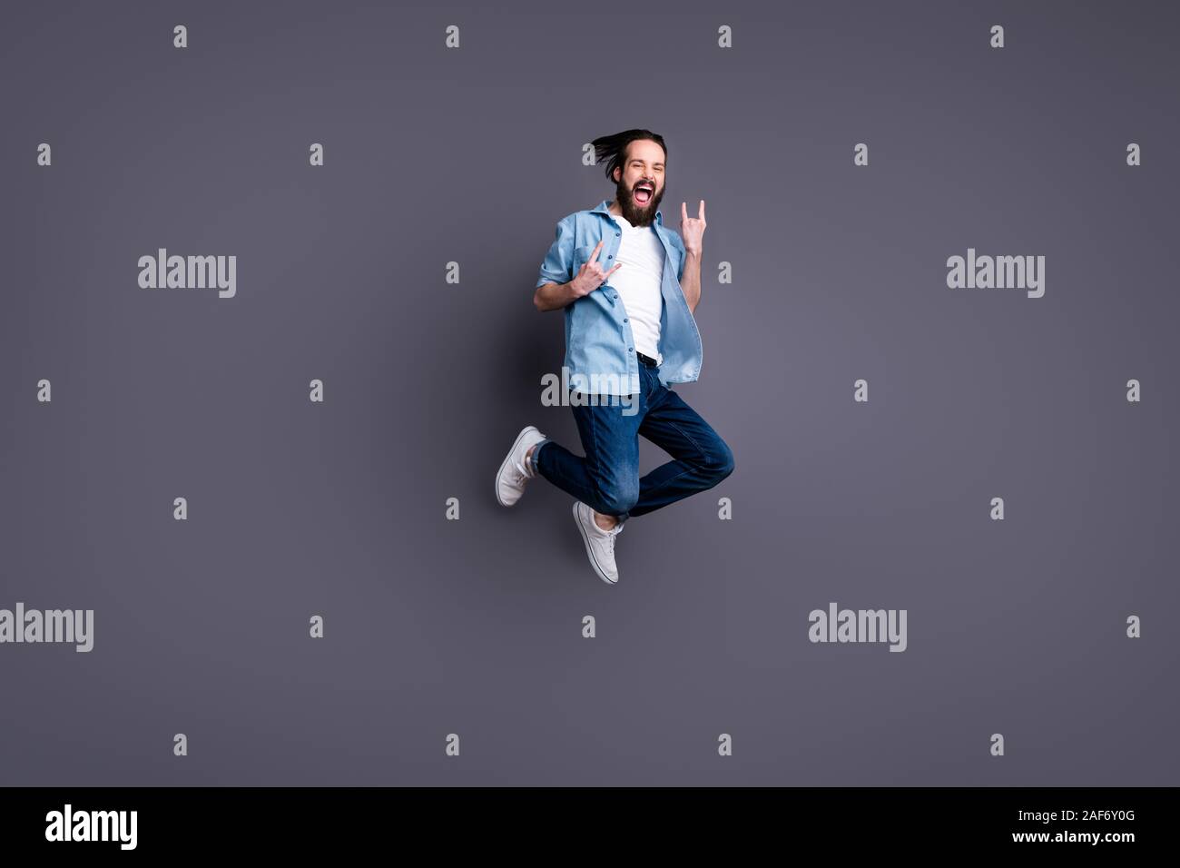 Full body photo of crazy funky cheerful rock roll lover guy jump show ...