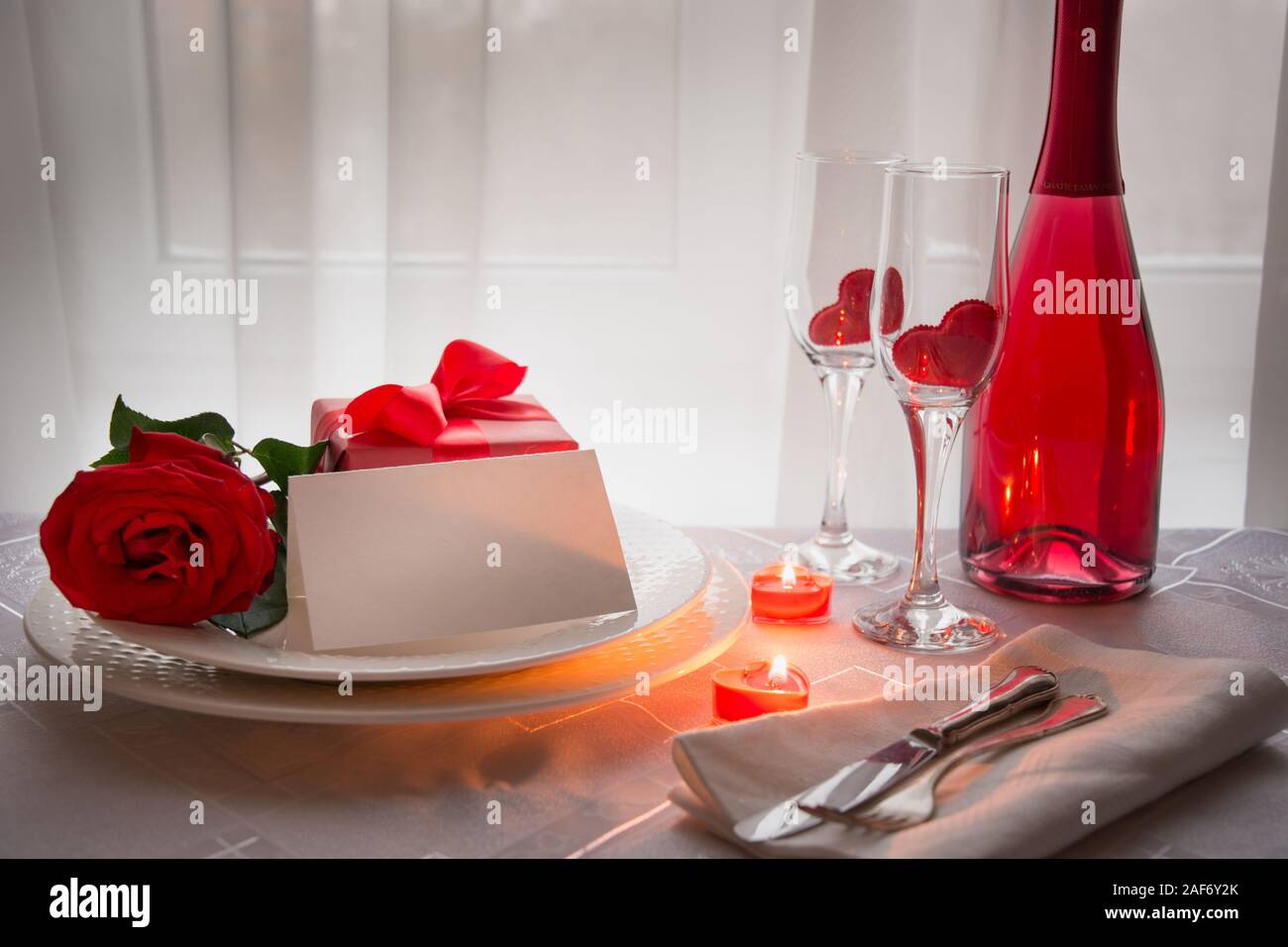 Festive or romantic dinner with red rose and champagne. Romantic ...
