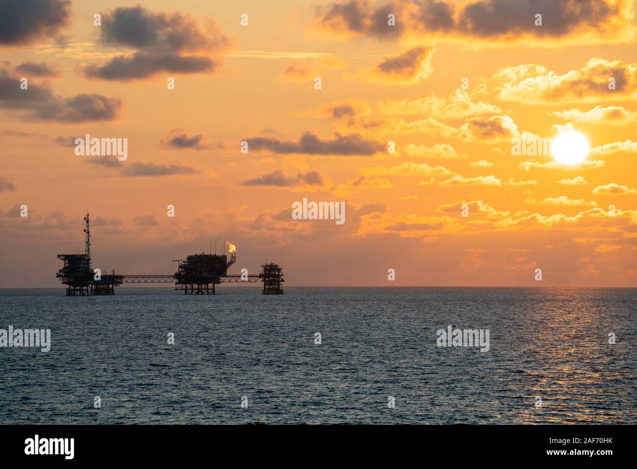 Oil Production Platform during sunset Stock Photo - Alamy