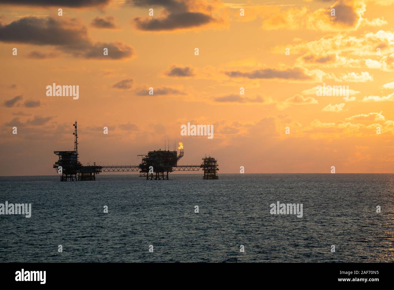 Oil Production Platform during sunset Stock Photo - Alamy