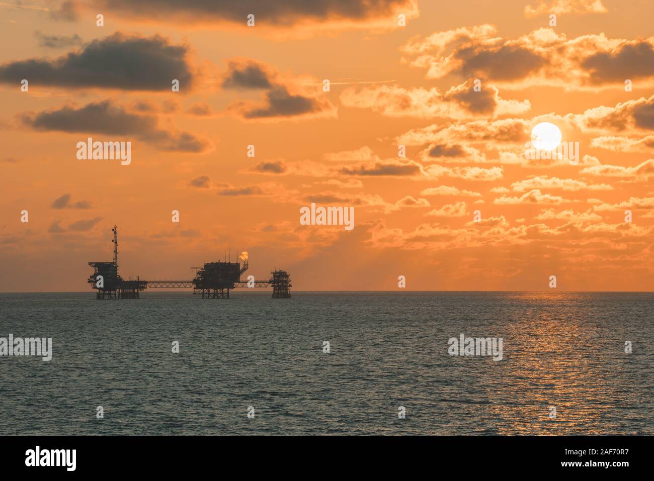 Oil Production Platform during sunset Stock Photo - Alamy