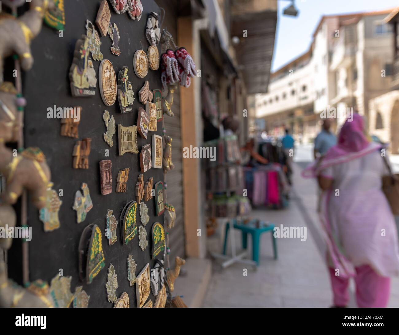 street view in an alley of Amman with artefacts and mementos on display ...