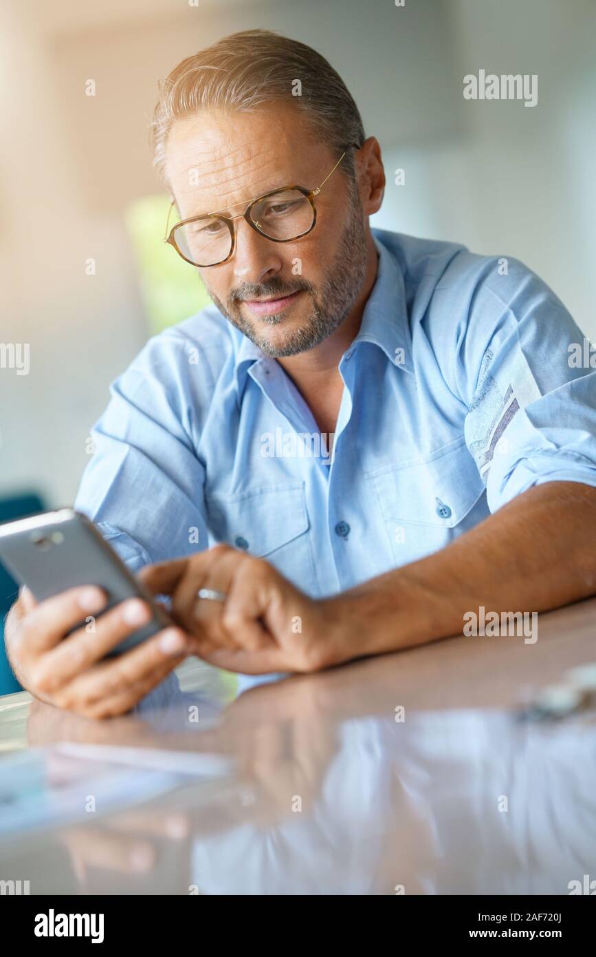 Thoughtful man typing message on hi-res stock photography and images ...