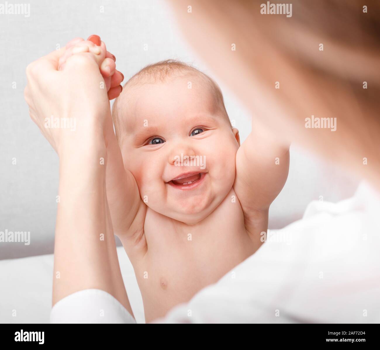 Infant massage hi-res stock photography and images - Alamy
