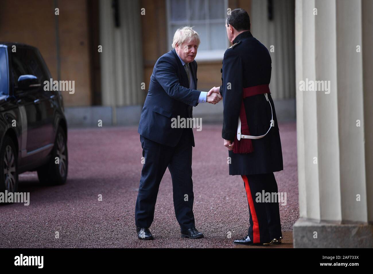 Prime Minister Boris Johnson (left) shakes hands with Queen's Equerry ...