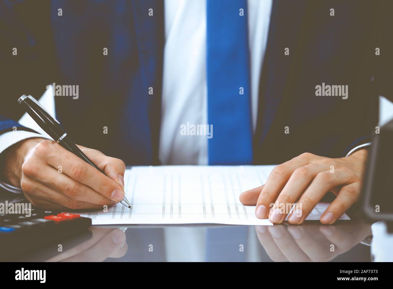 Bookkeeper or financial inspector hands making report, calculating or ...