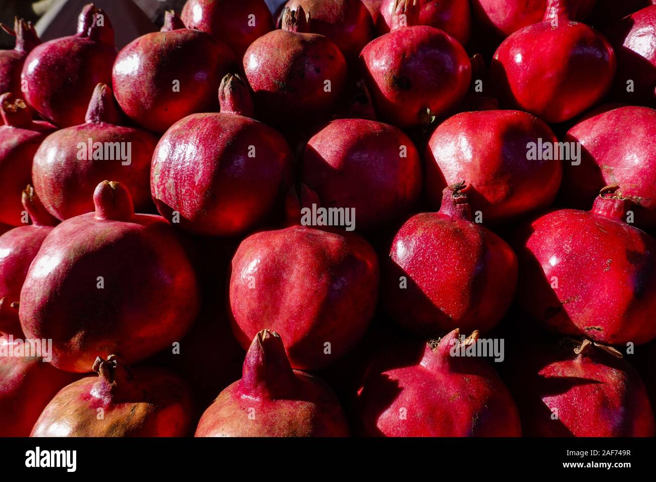 Kiev, Ukraine A pile of pomegranates at a fruit stand inthe Zhitnii ...