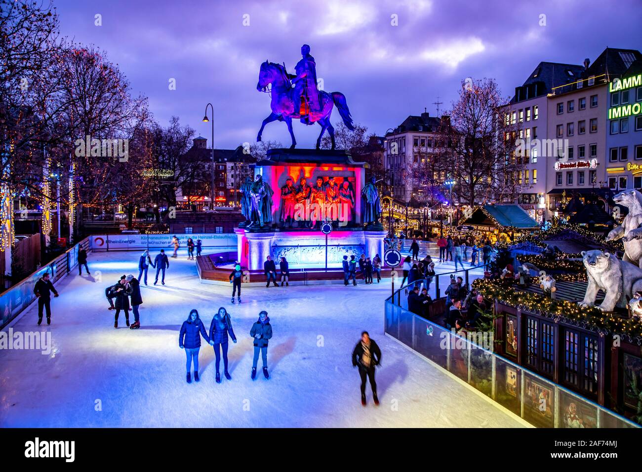 Cologne, Christmas market on the Heumarkt, ice rink Stock Photo - Alamy