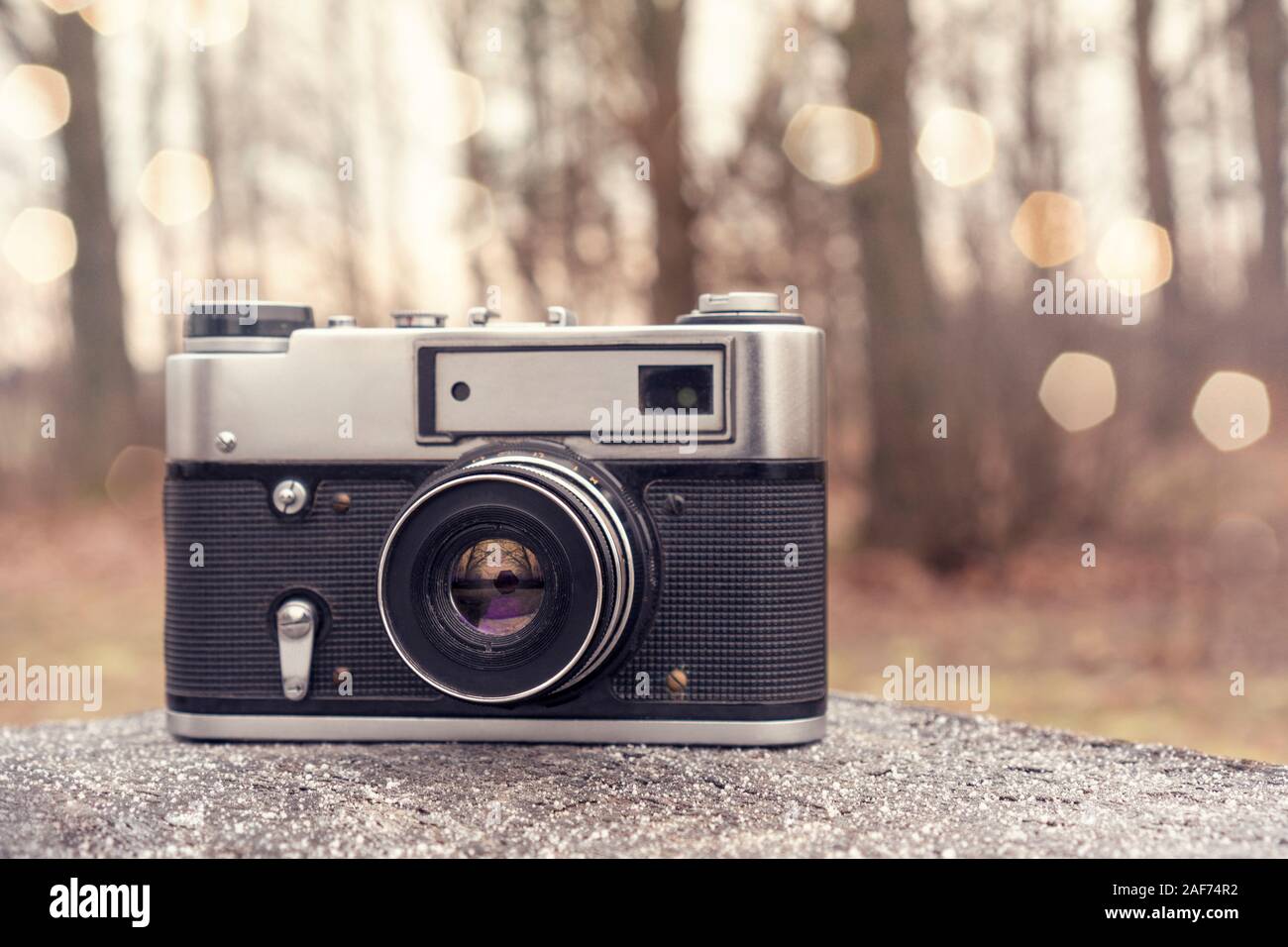 Old 35mm camera in the forest. Nature Photography Concept Stock Photo ...
