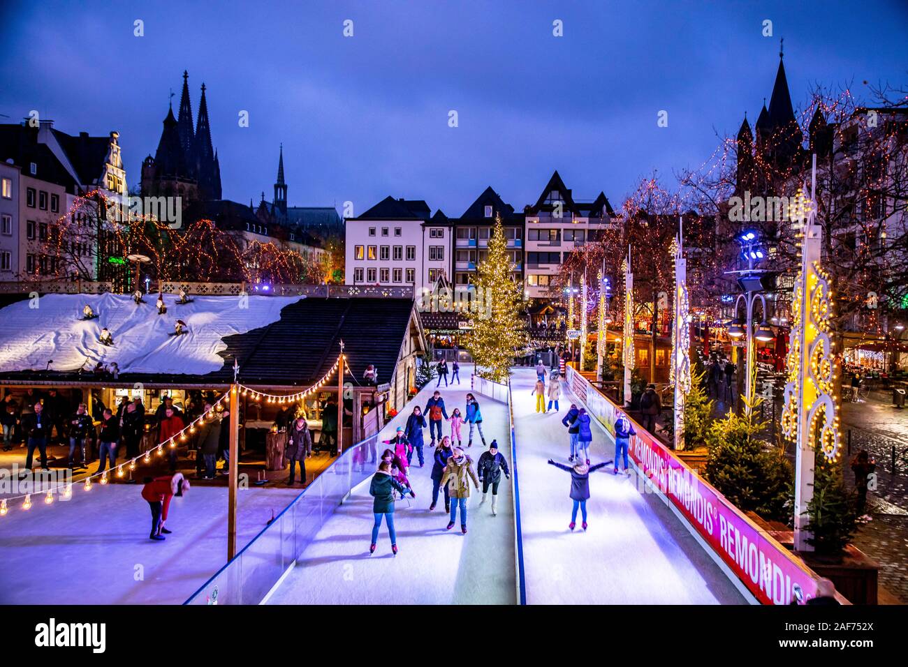 Cologne, Christmas market on the Heumarkt, ice rink Stock Photo - Alamy