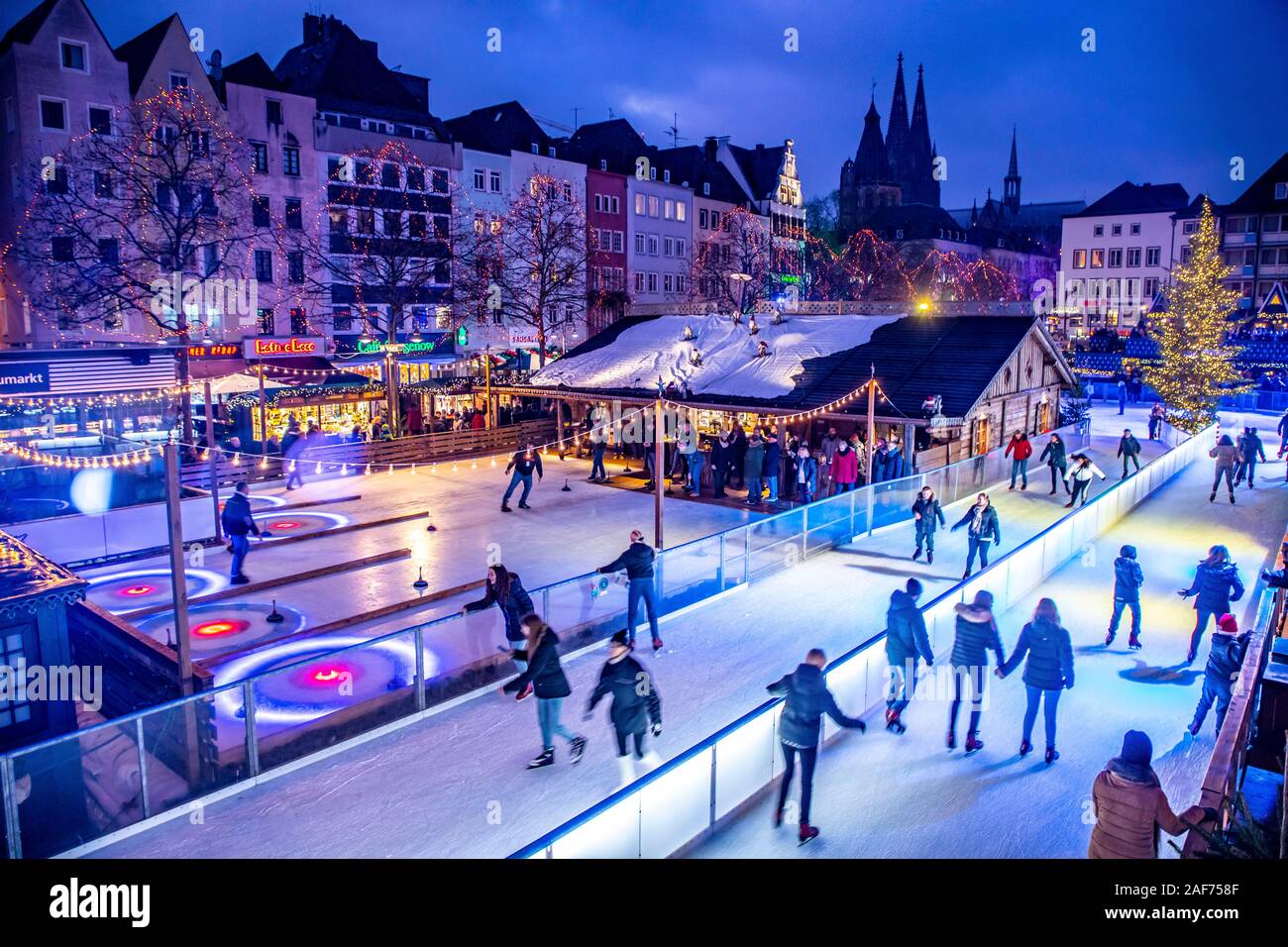 Cologne, Christmas market on the Heumarkt, ice rink Stock Photo - Alamy