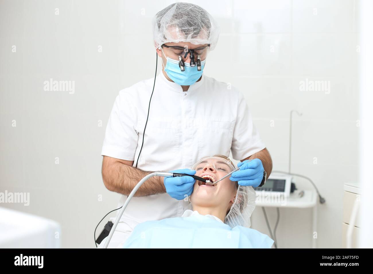 Dentist checkup procedure with female patient on chair. Selective focus Stock Photo - Alamy