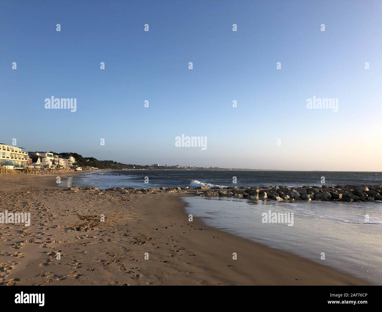 A beautiful day on Sandbanks Beach, with te wind blowing to gale force ...